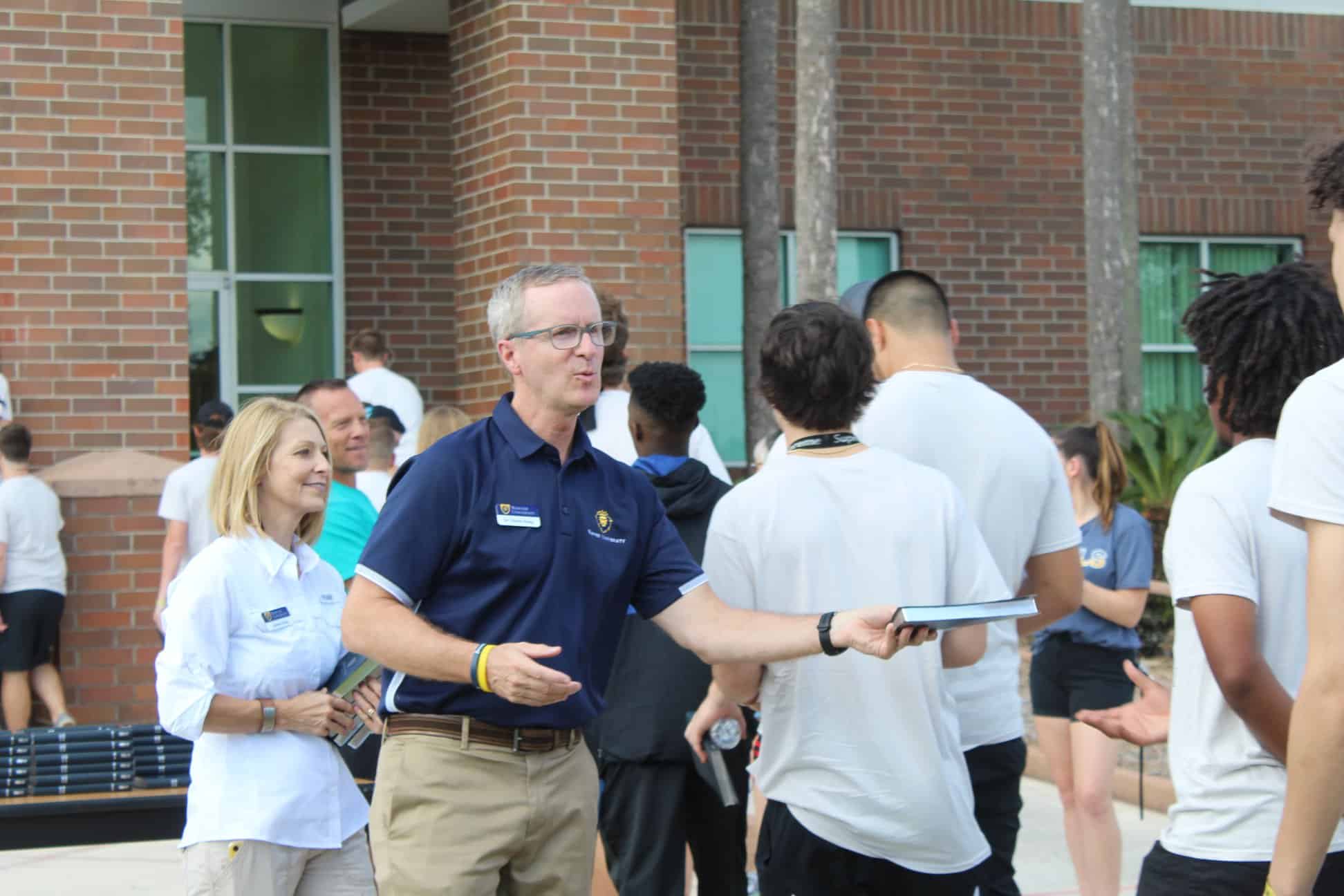 Handing out Bibles – Warner University